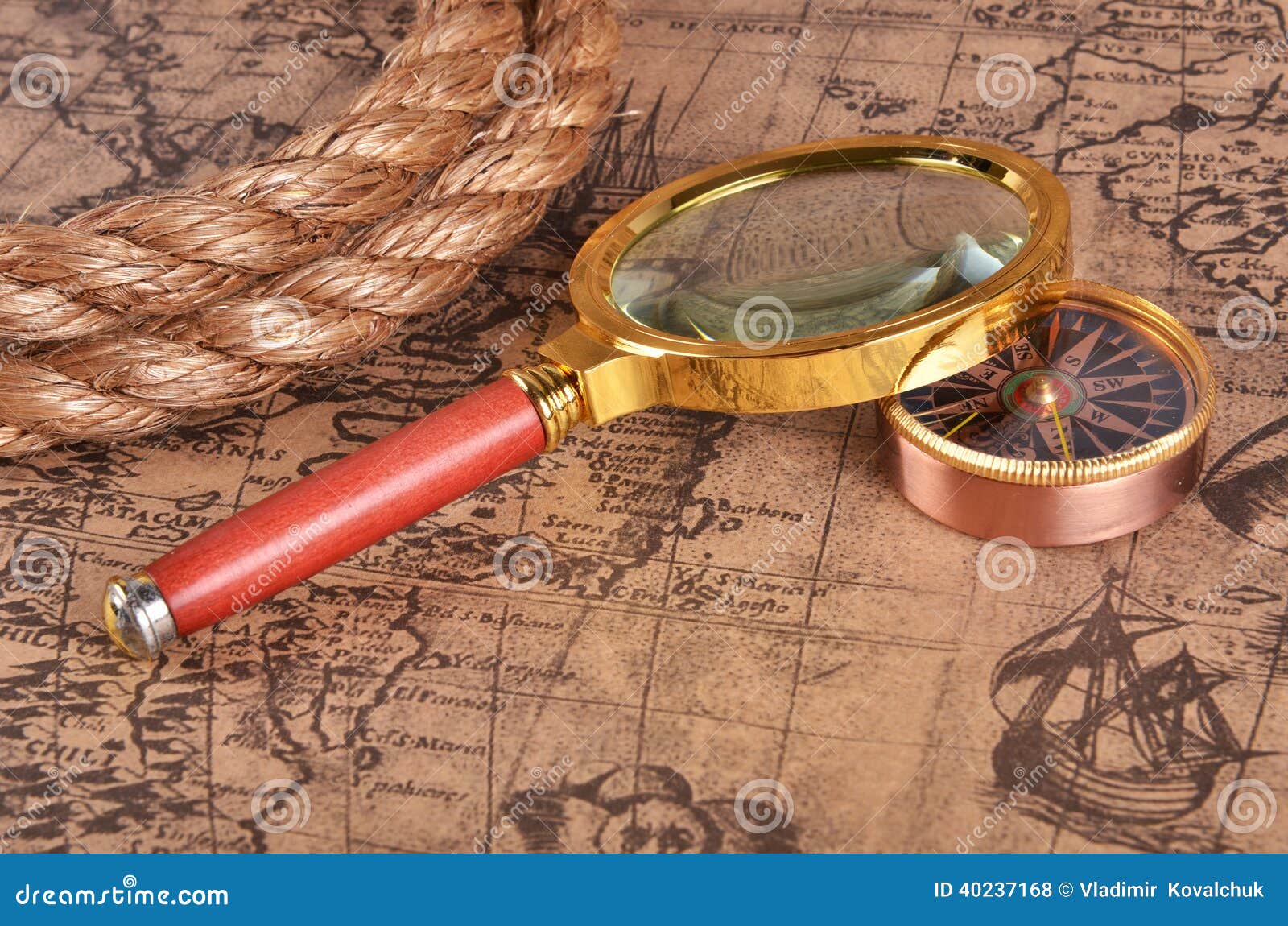 Magnifying Glass and Compass on the Ancient Map Stock Photo - Image of ...