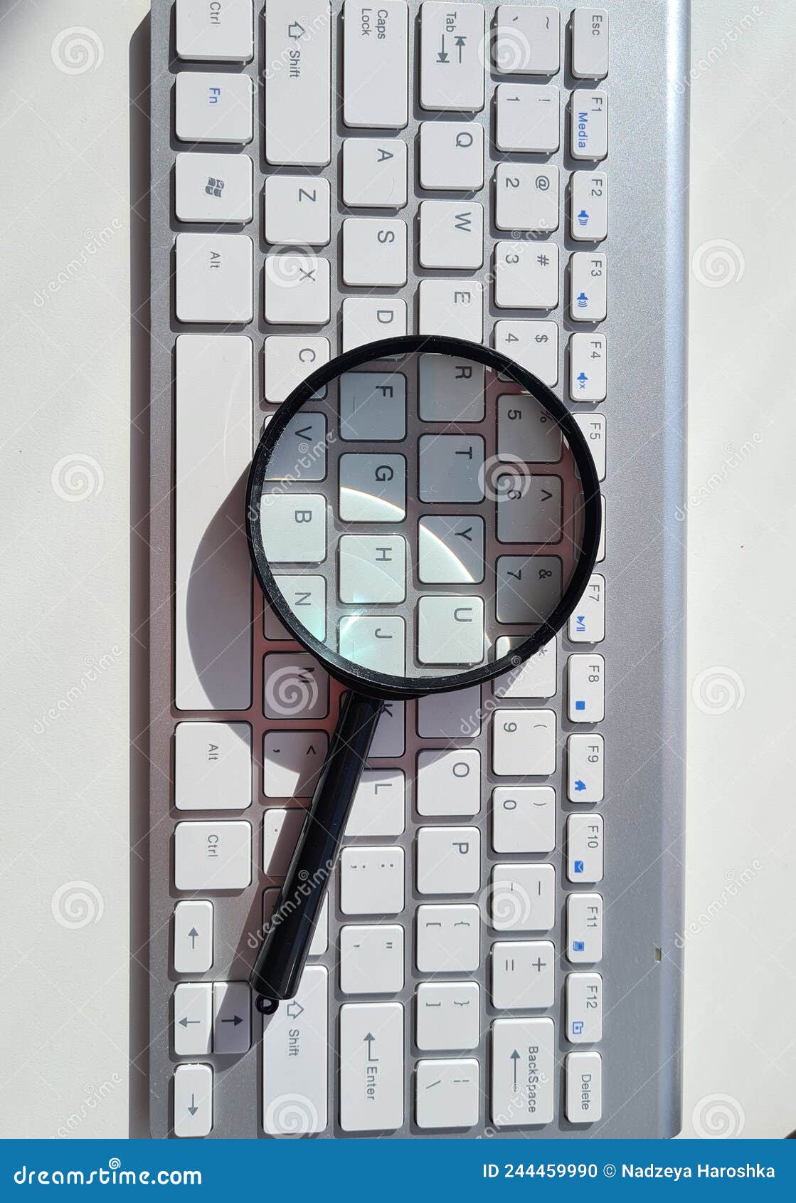 Magnifying Glass on Computer Keyboard and Searching for Information on ...