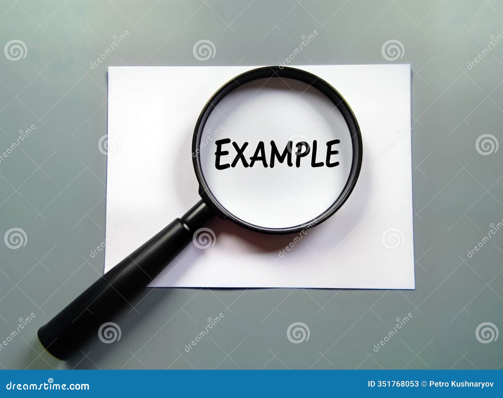Magnifying Glass Focuses on Word Example on White Paper. Study or ...