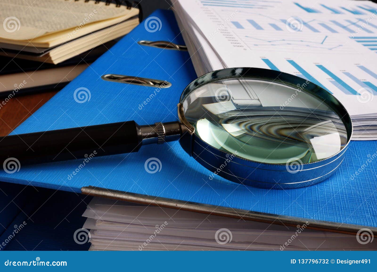 Magnifying Glass and Folder with Pile of Business Documents Stock Photo ...