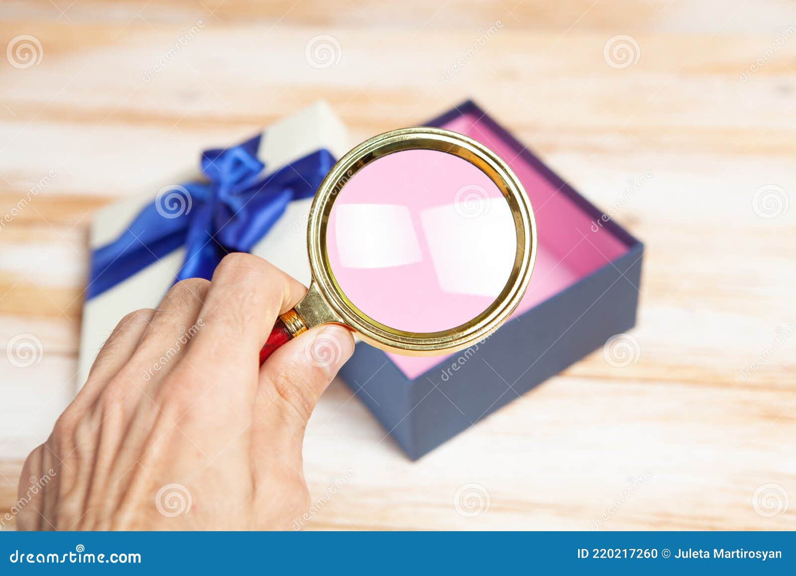 Magnifying Glass and a Gift Stock Photo - Image of child, young: 220217260