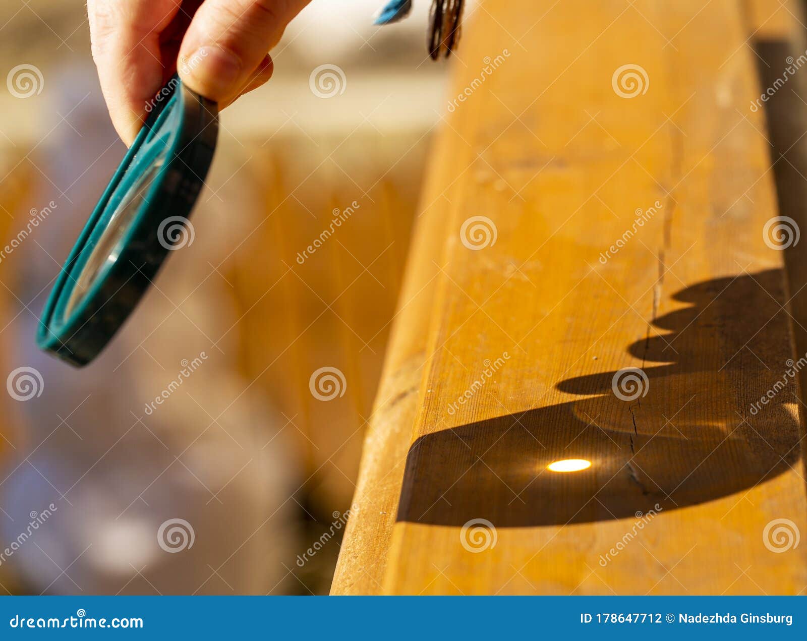 A Magnifying Glass in the Hands of a Man Who Teaches a Child To Make a ...