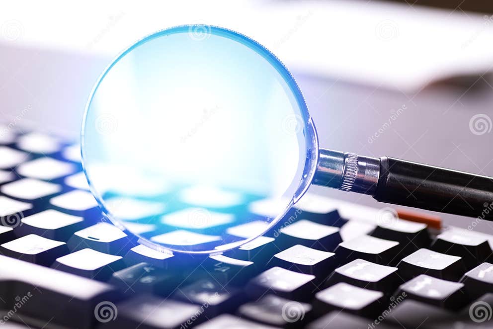 Magnifying Glass on the Keys of a Black Computer Keyboard Stock Image ...