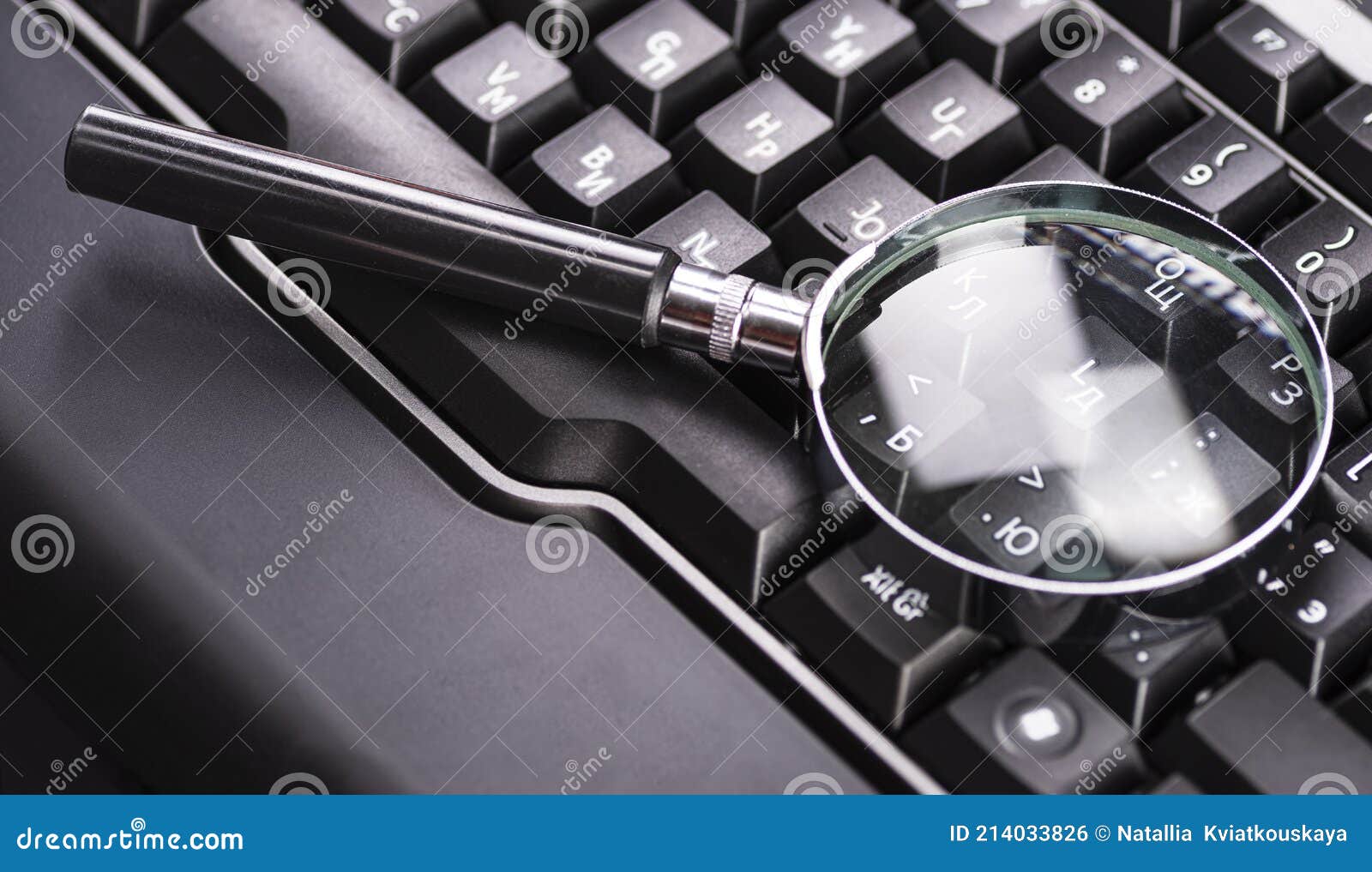 Magnifying Glass on the Keys of a Black Computer Keyboard Stock Photo ...