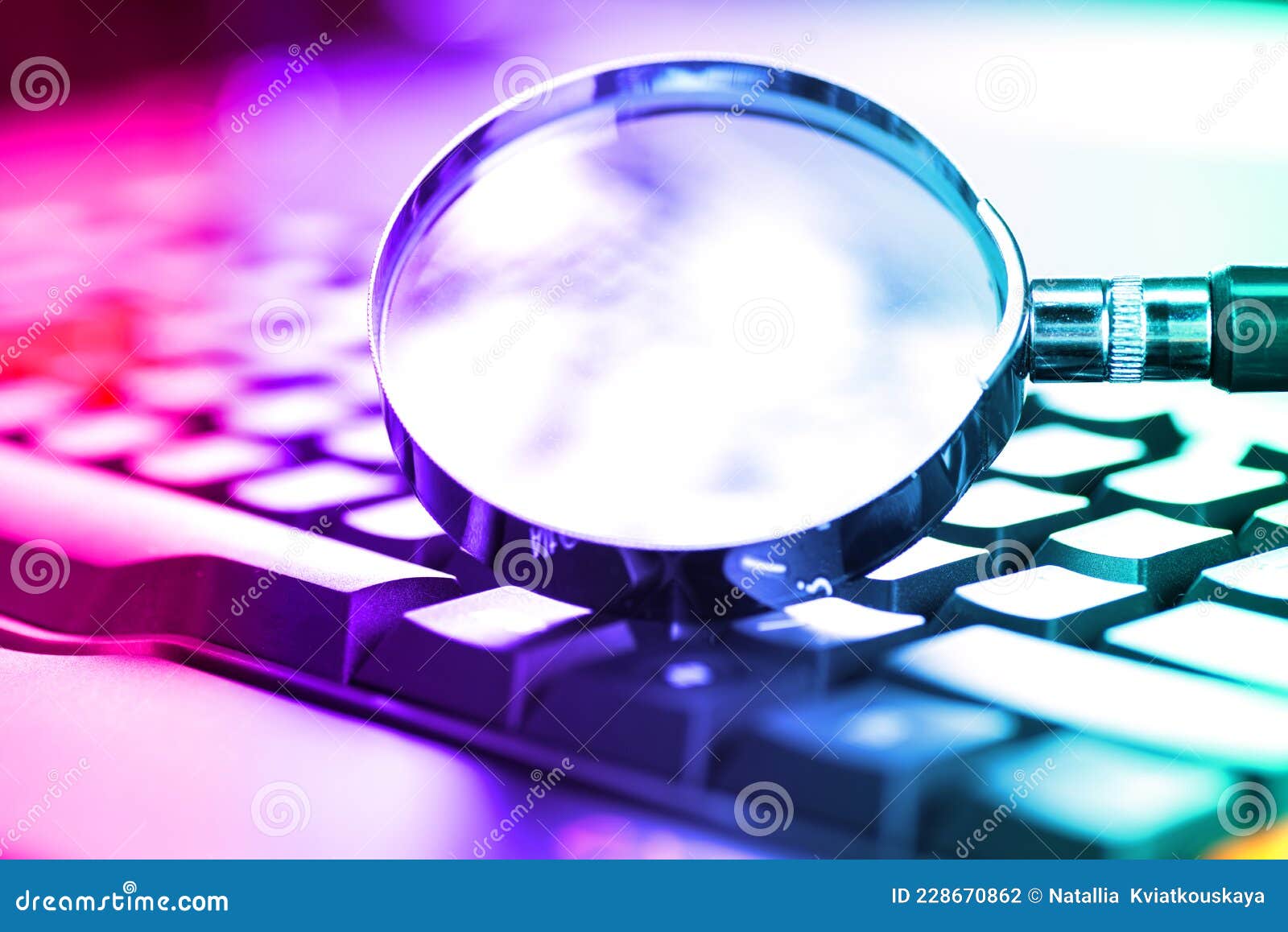 Magnifying Glass on the Keys of a Black Computer Keyboard in Neon Light ...