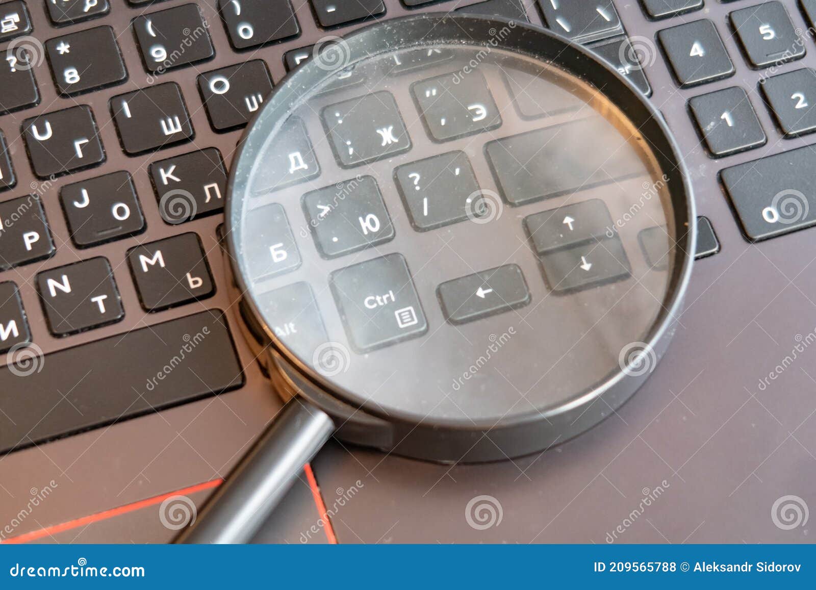 The Magnifying Glass on the Laptop Keyboard Symbolizes the Process of ...