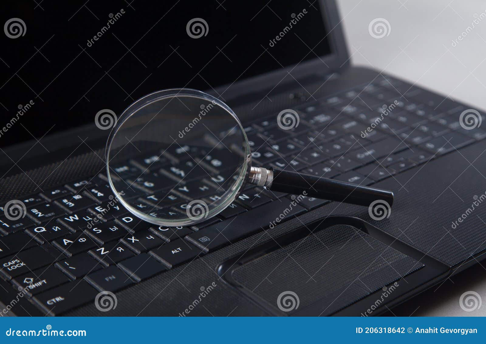 Magnifying Glass is Located on the Keyboard. Black Color Computer and ...