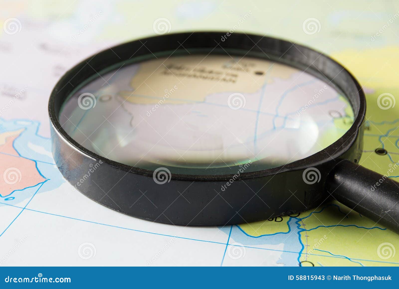 Magnifying glass on a map stock image. Image of education - 58815943