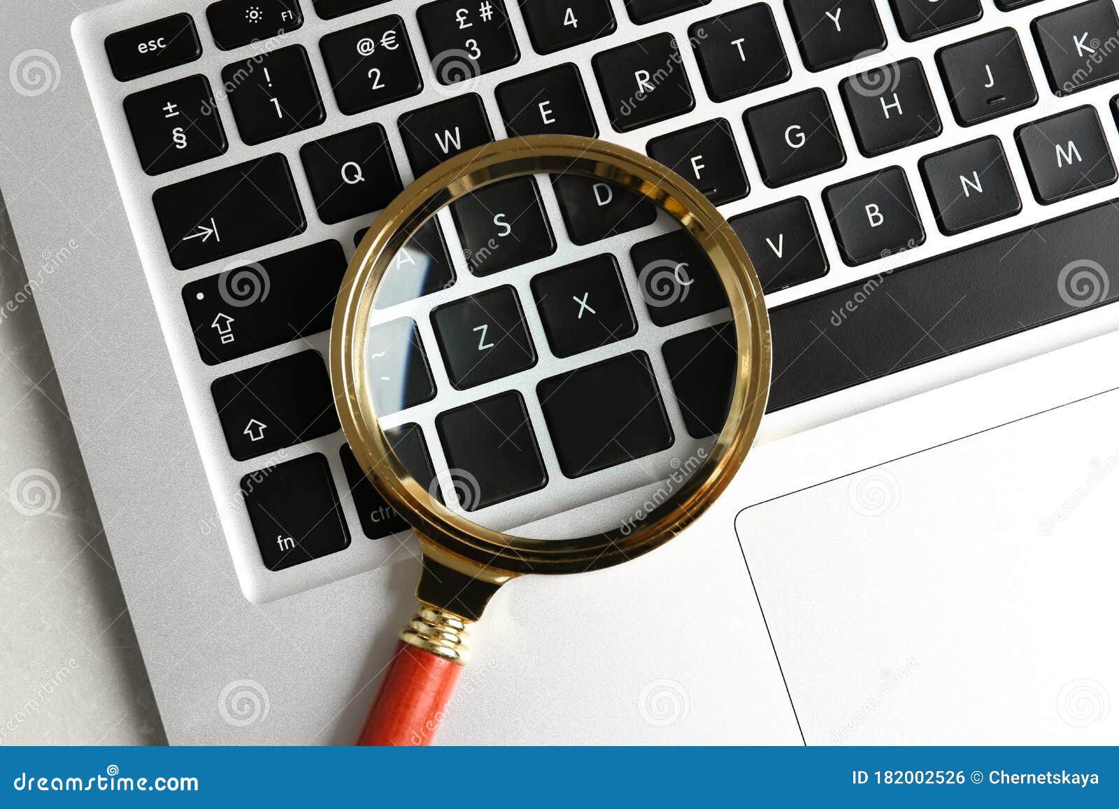Magnifying Glass and Modern Laptop on Table. Search Concept Stock Photo ...
