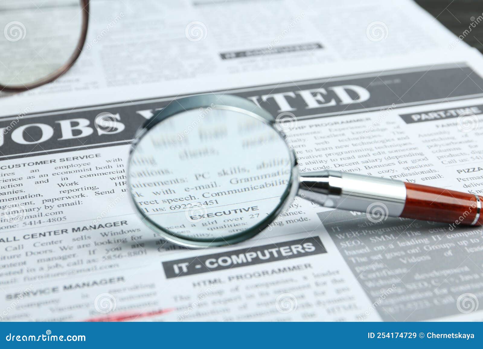 Magnifying Glass on Newspaper. Job Search Concept Stock Image - Image ...