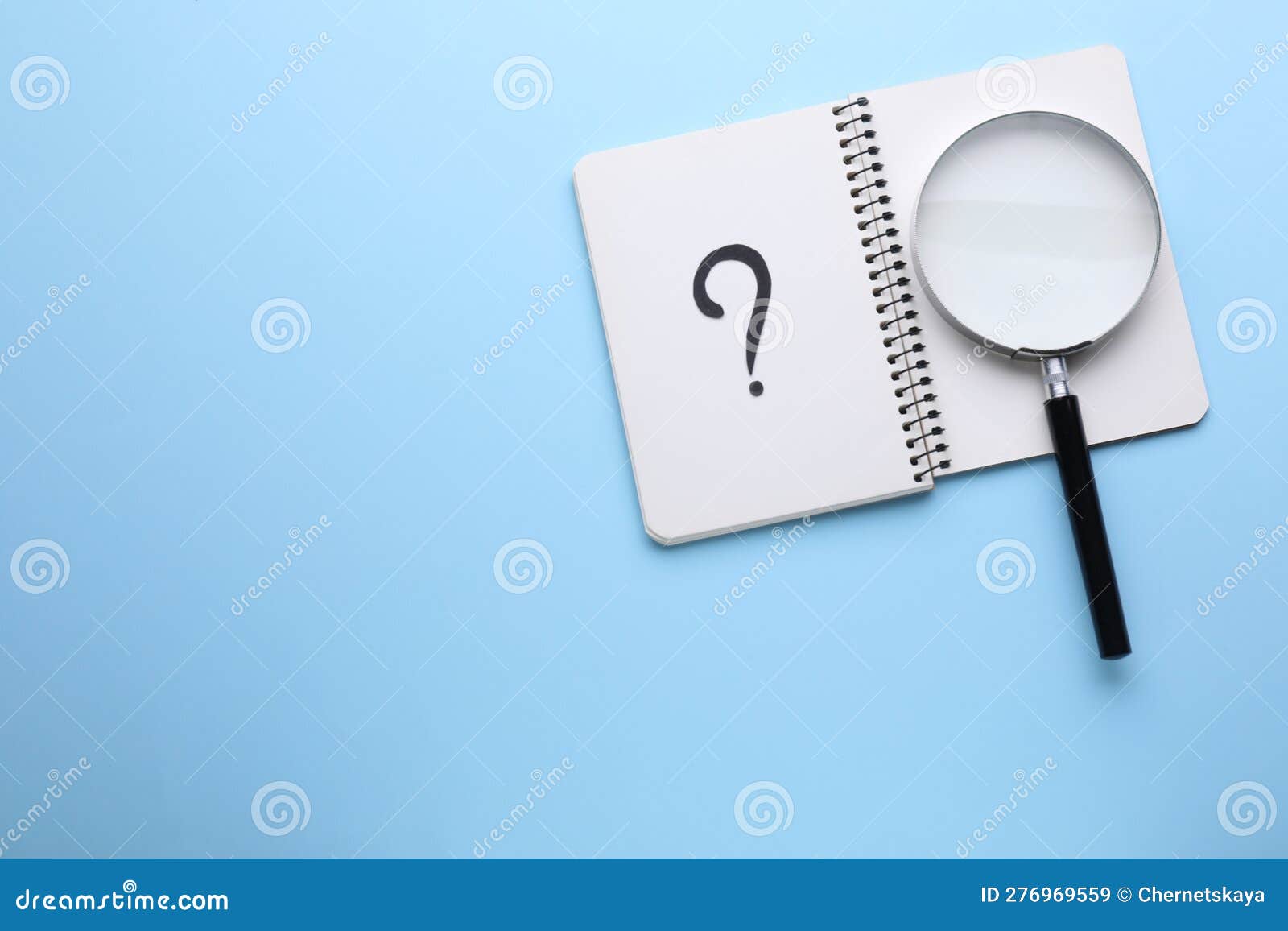 Magnifying Glass and Notebook with Question Mark on Light Blue ...