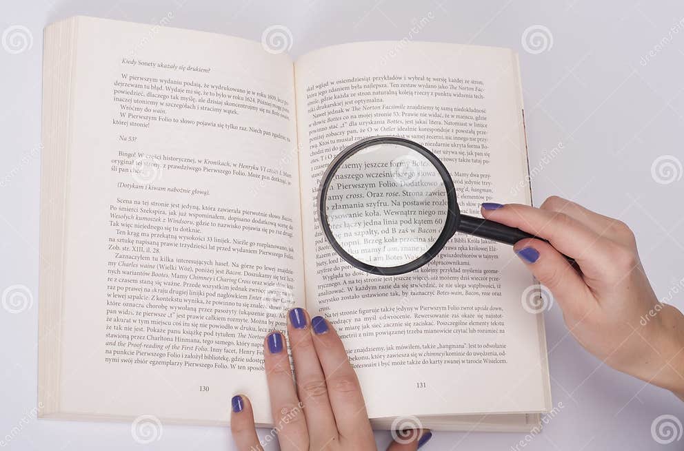 Magnifying glass over book stock image. Image of marker - 28335293