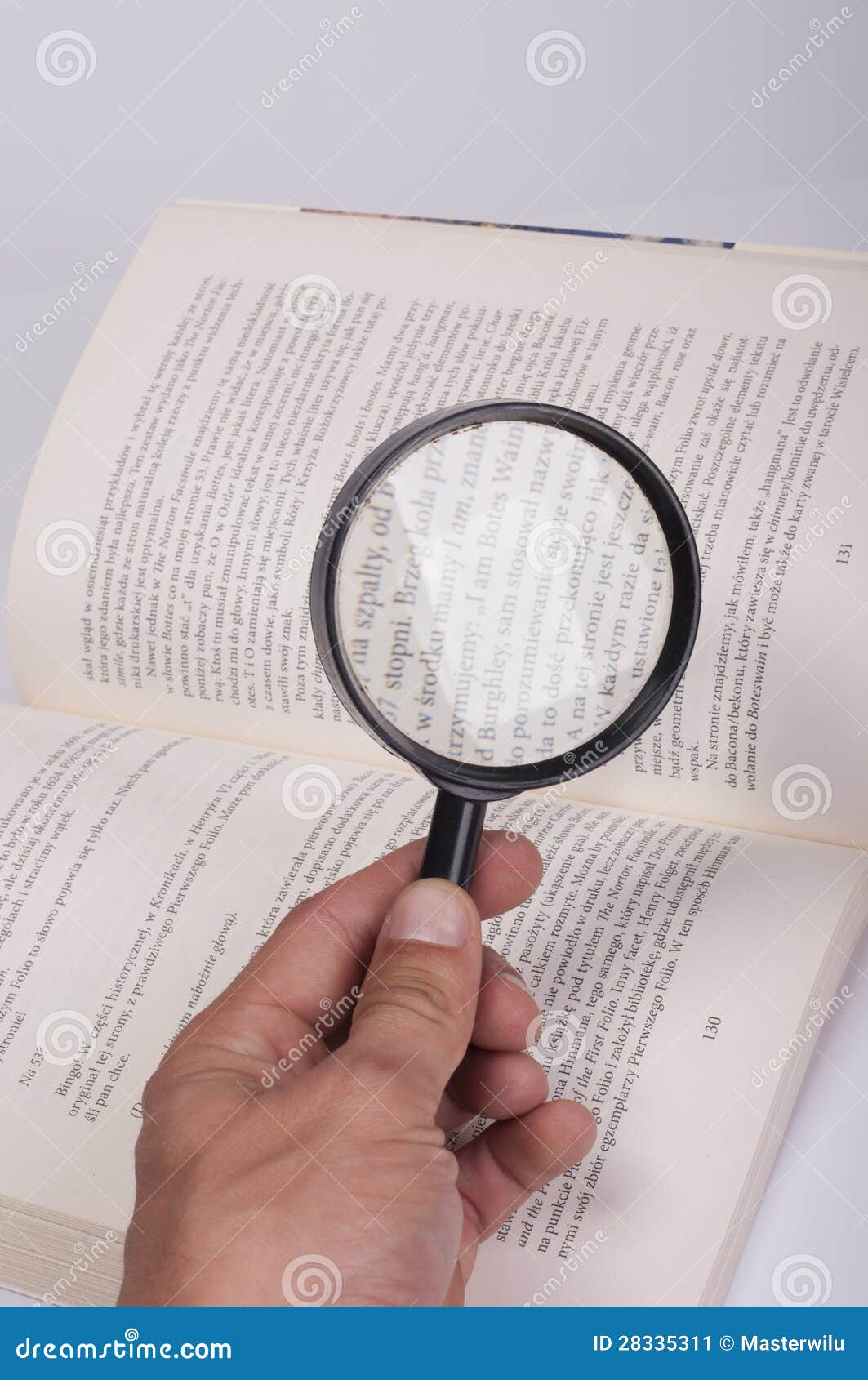Magnifying glass over book stock image. Image of finance - 28335311