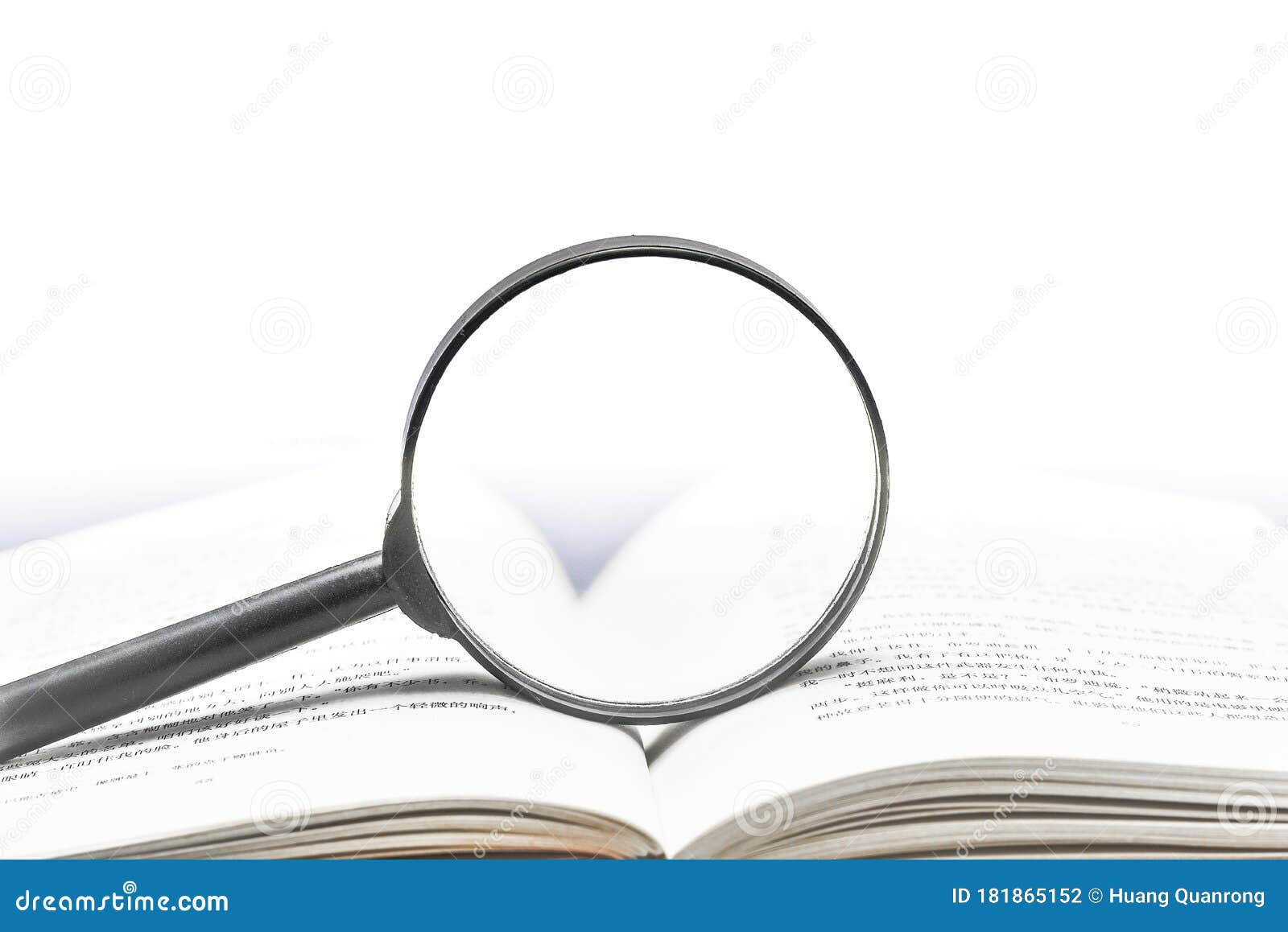 A Magnifying Glass is Placed in an Open Book. Stock Photo - Image of ...