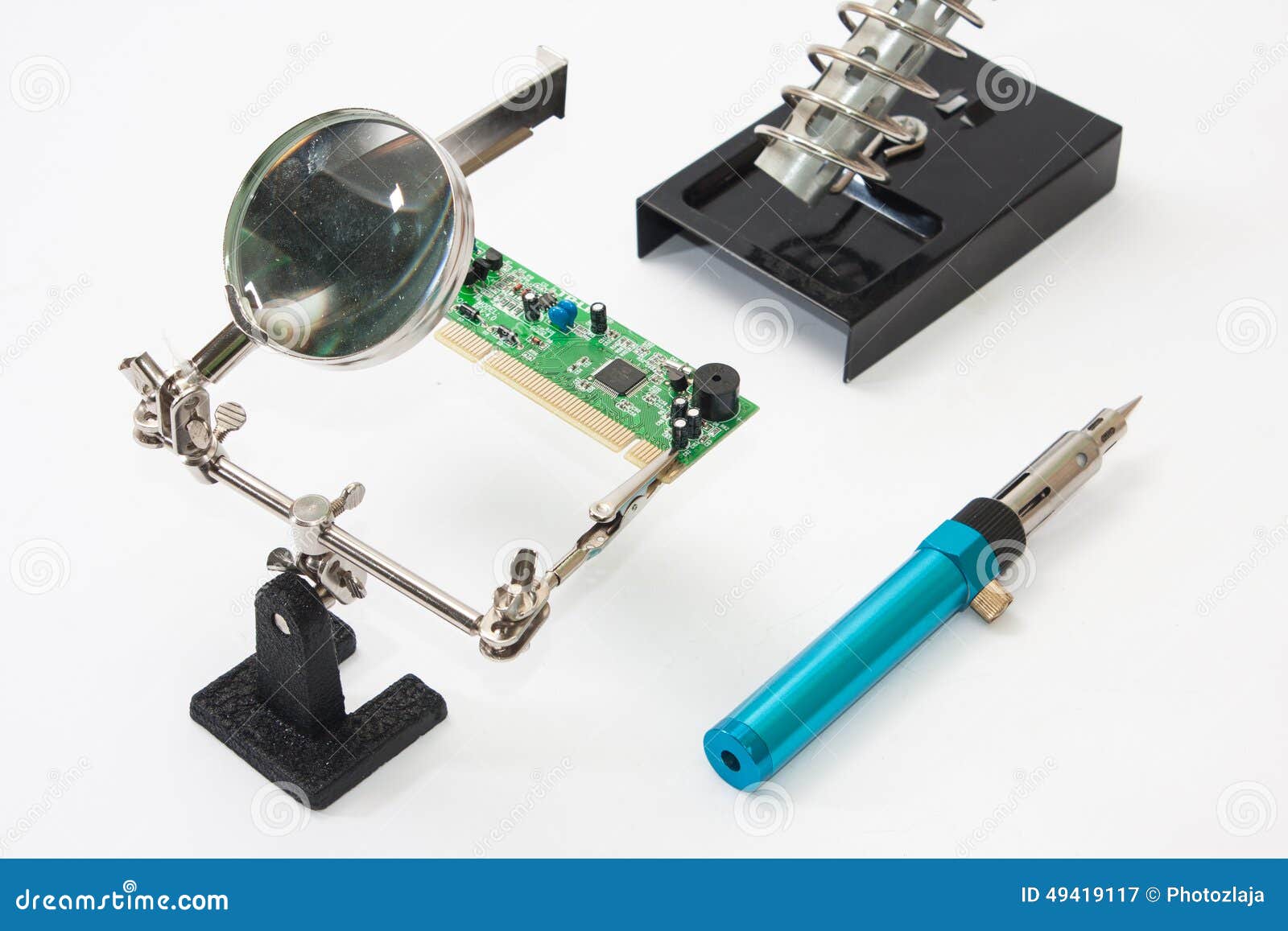 Magnifying Glass with Printed Circuit Board and Soldering Iron Stock ...