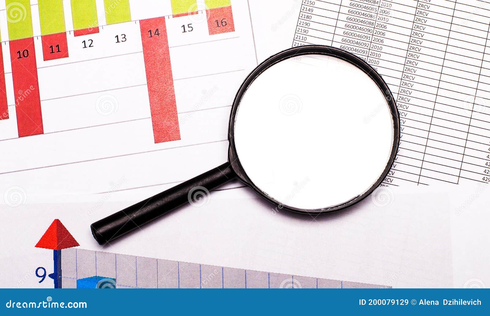 A Magnifying Glass and Reports are on the Desktop. Business Concept ...