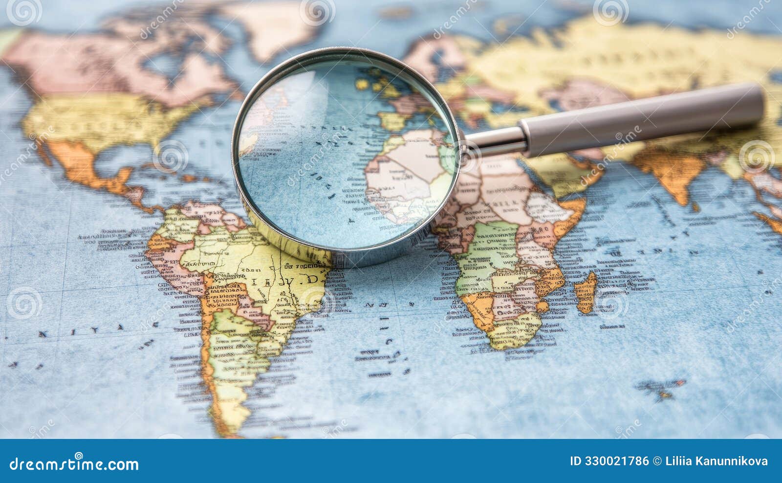 A Magnifying Glass Rests on a World Map, Emphasizing Particular Regions ...