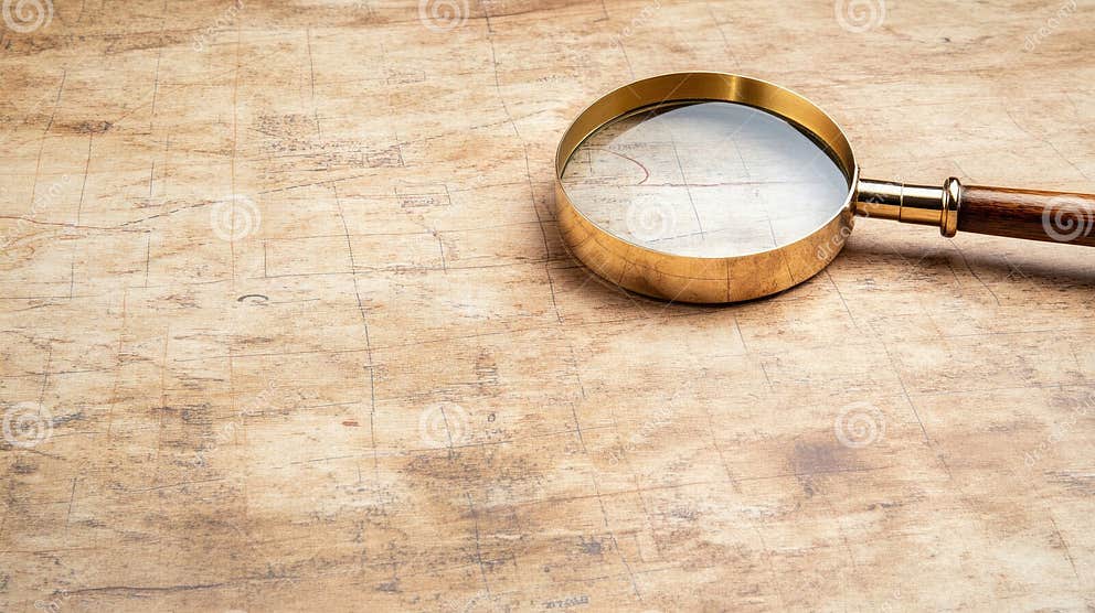 A Magnifying Glass Rests on a World Map, Emphasizing Particular Regions ...