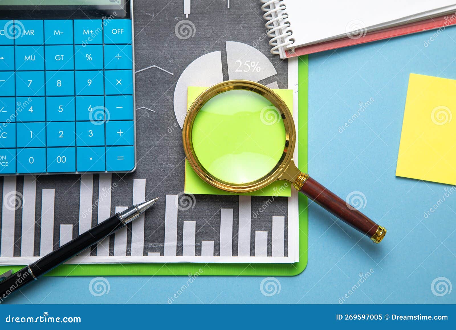 Magnifying Glass with a Sticky Note on Financial Graphs Stock Image ...