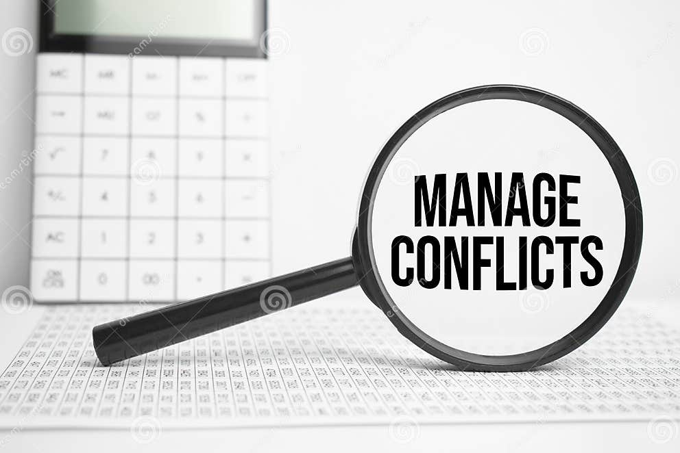 Magnifying Glass with Text MANAGE CONFLICTS on White Table with ...
