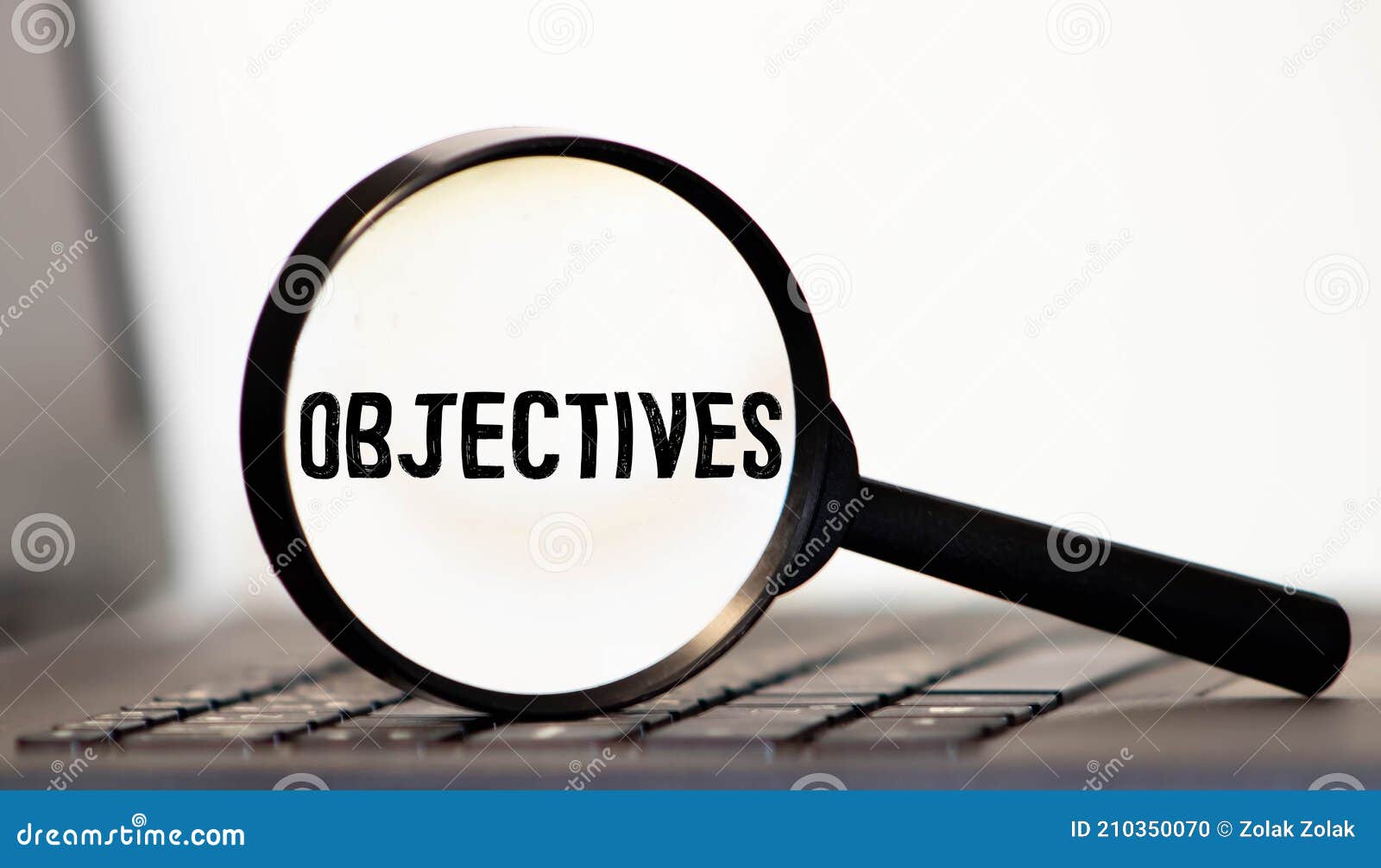 Magnifying Glass with Text Objectives on Wooden Table Stock Photo ...
