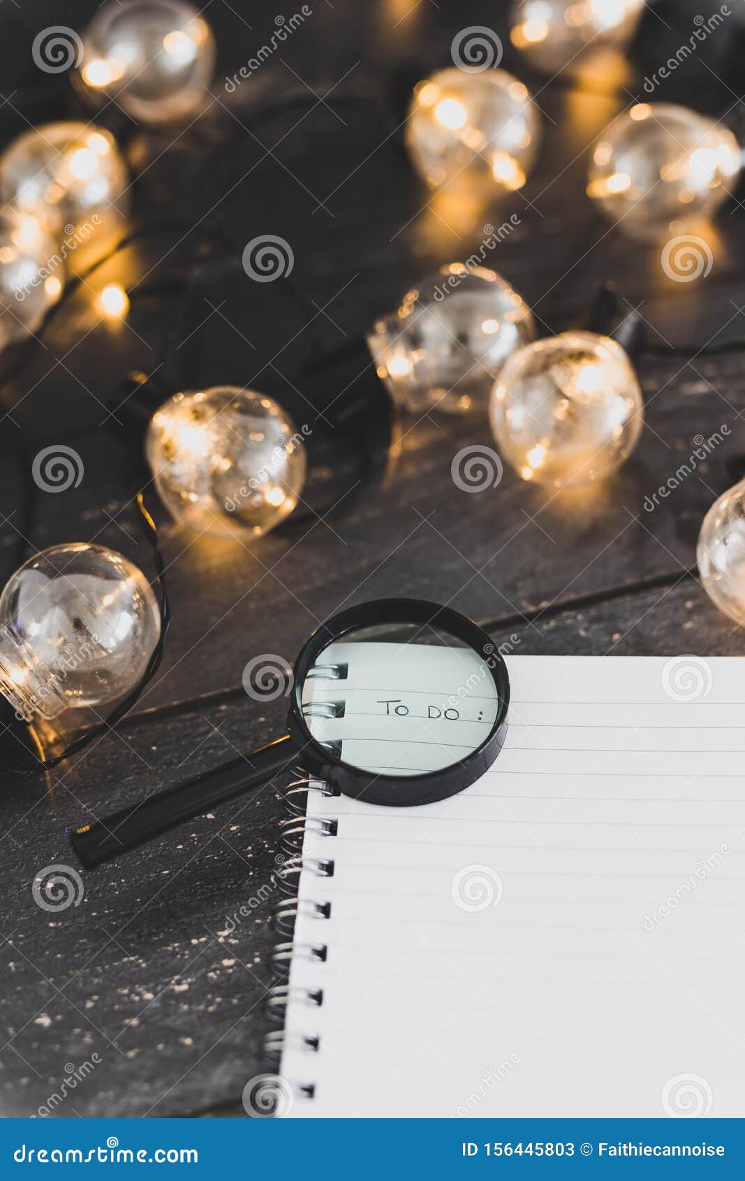 Magnifying Glass on To Do List Surrounded by Lightbulb String Lights ...