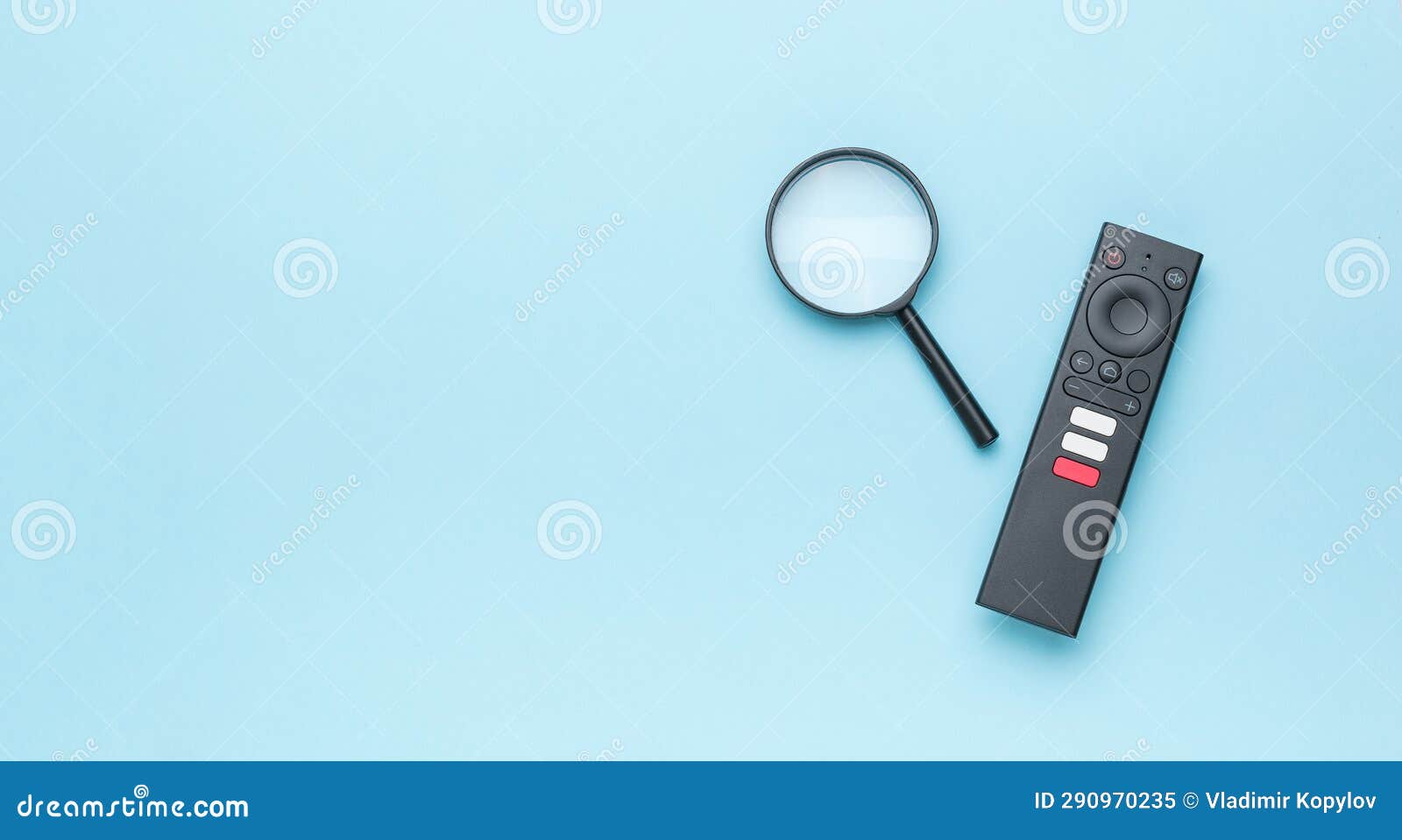 Magnifying Glass and TV Remote Control on a Blue Background. TV ...