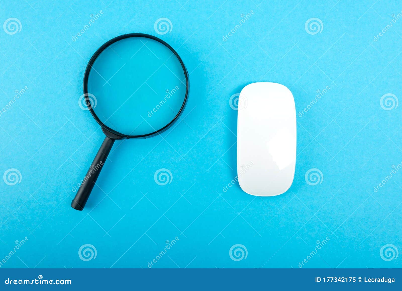 Magnifying Glass and White Pc Mouse on Blue Table. Stock Image - Image ...