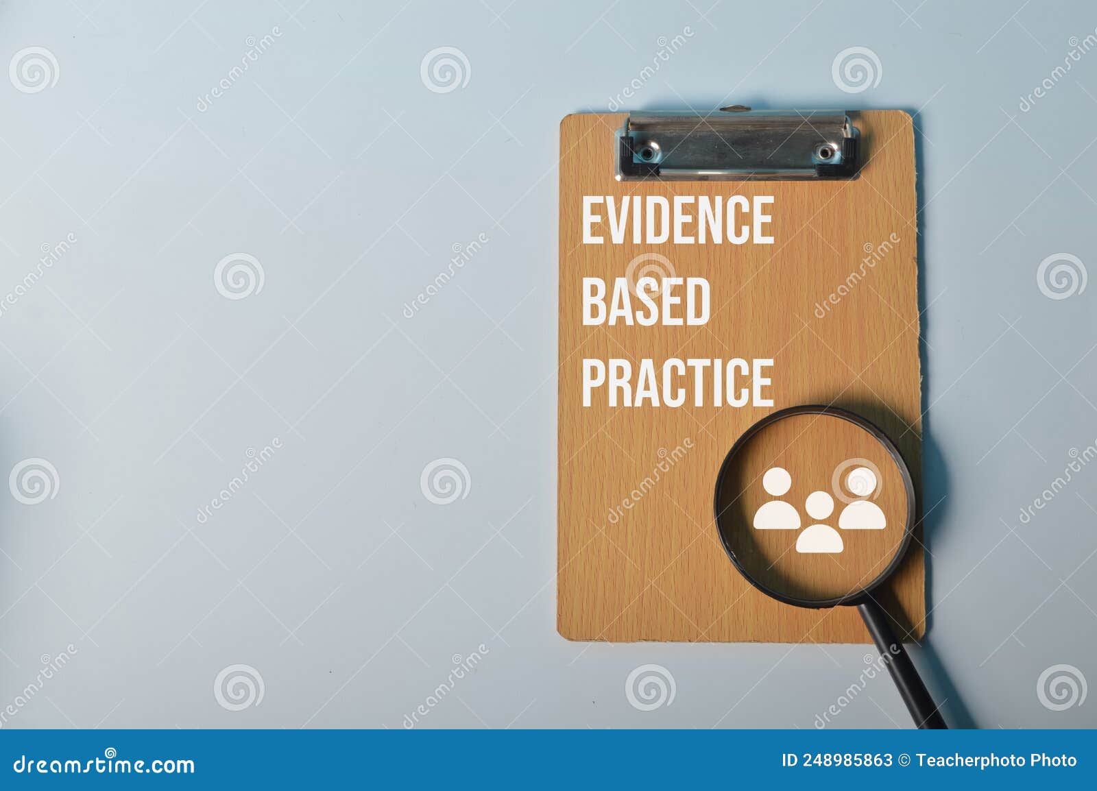 Magnifying Glass and Wooden Clipboard with Text EVIDENCE BASED PRACTICE ...
