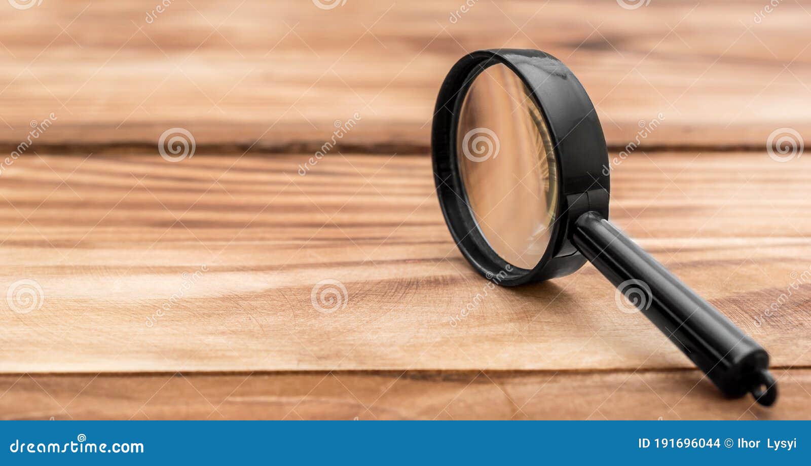Magnifying Glass on Wooden Table. Close Up Stock Photo - Image of ...