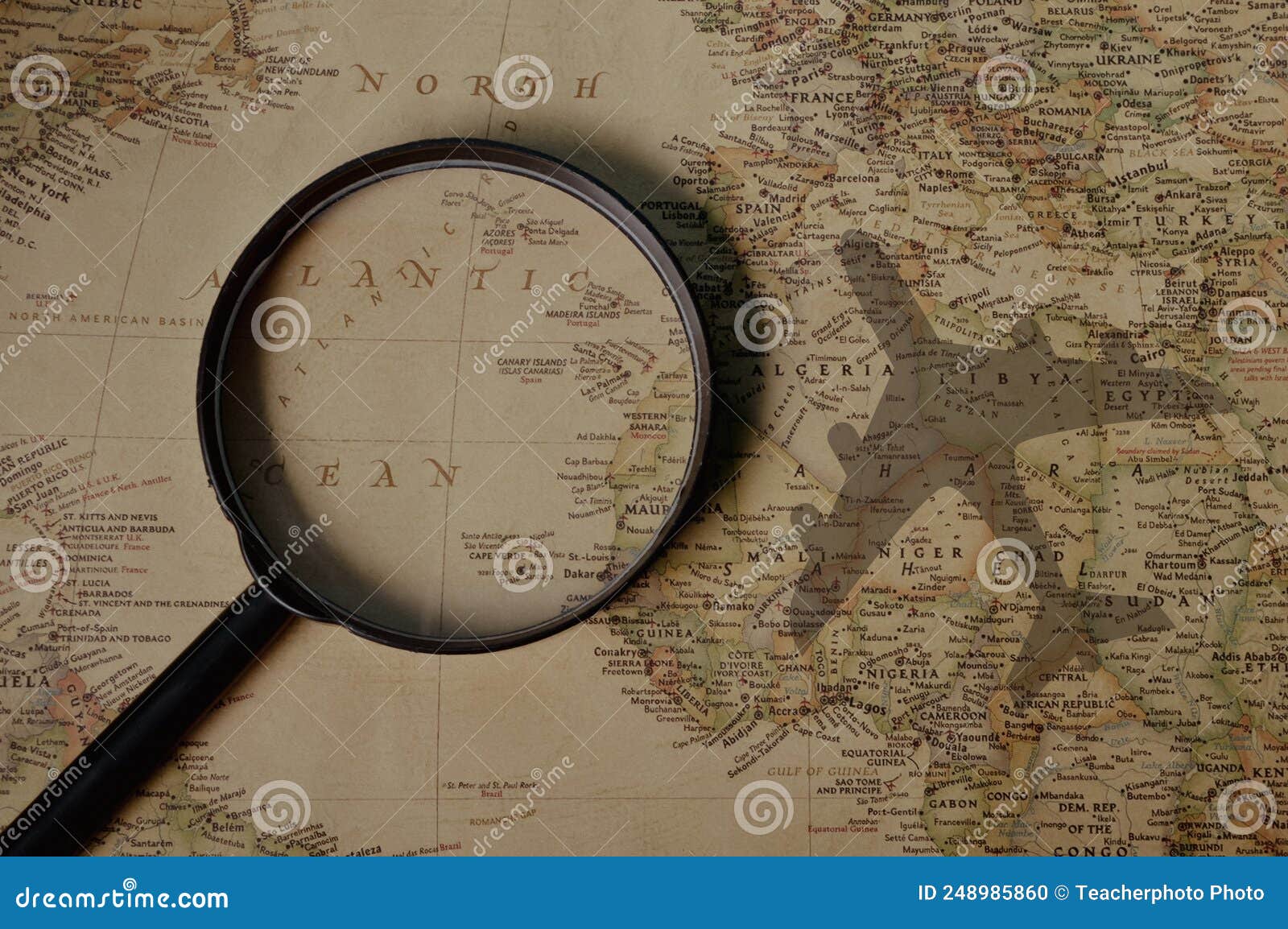 Magnifying Glass on World Travel Map with Airplane Stock Photo - Image ...