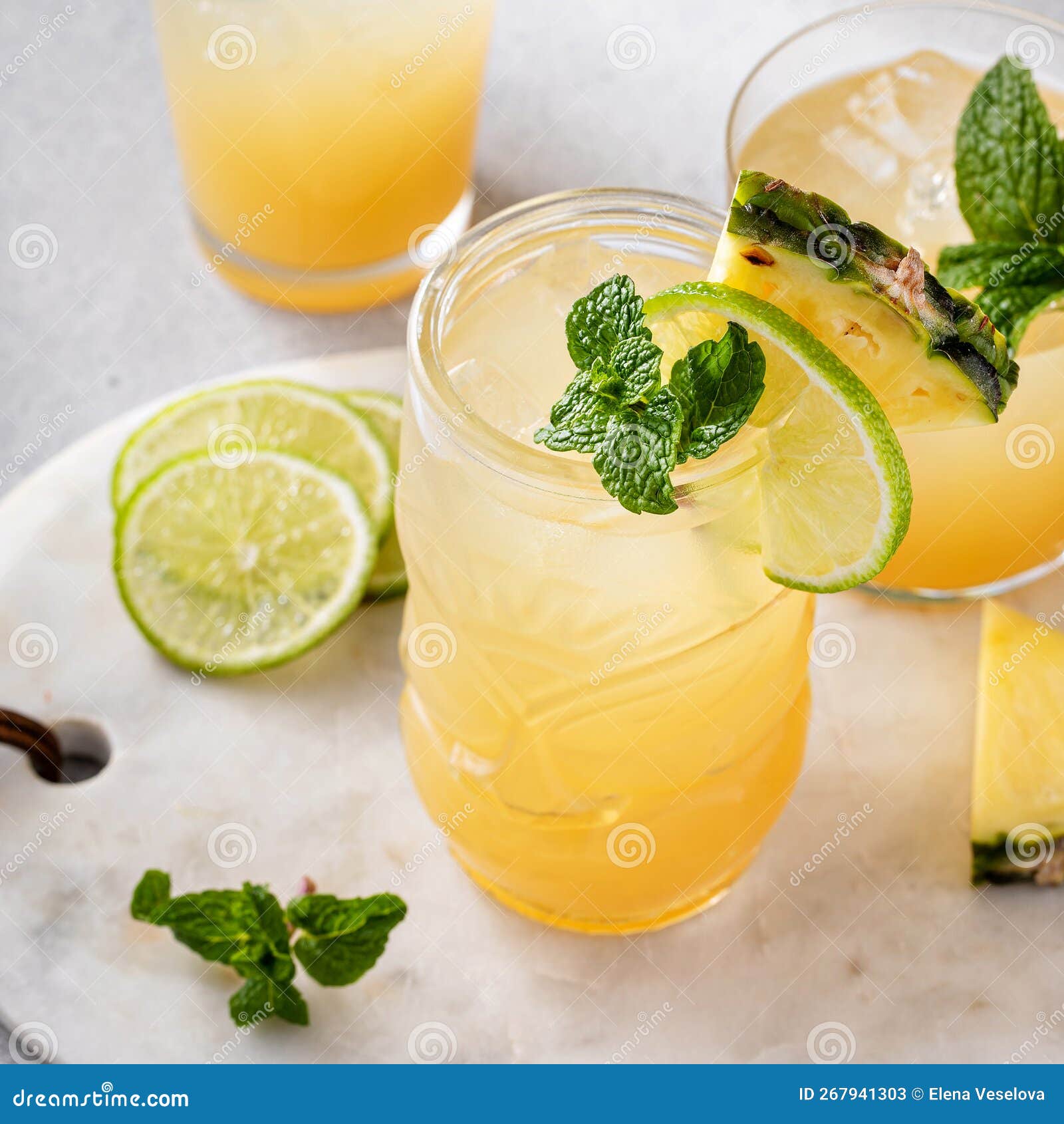 Mai Tai Cocktail in Different Glasses Garnished with Pineapple and Lime ...