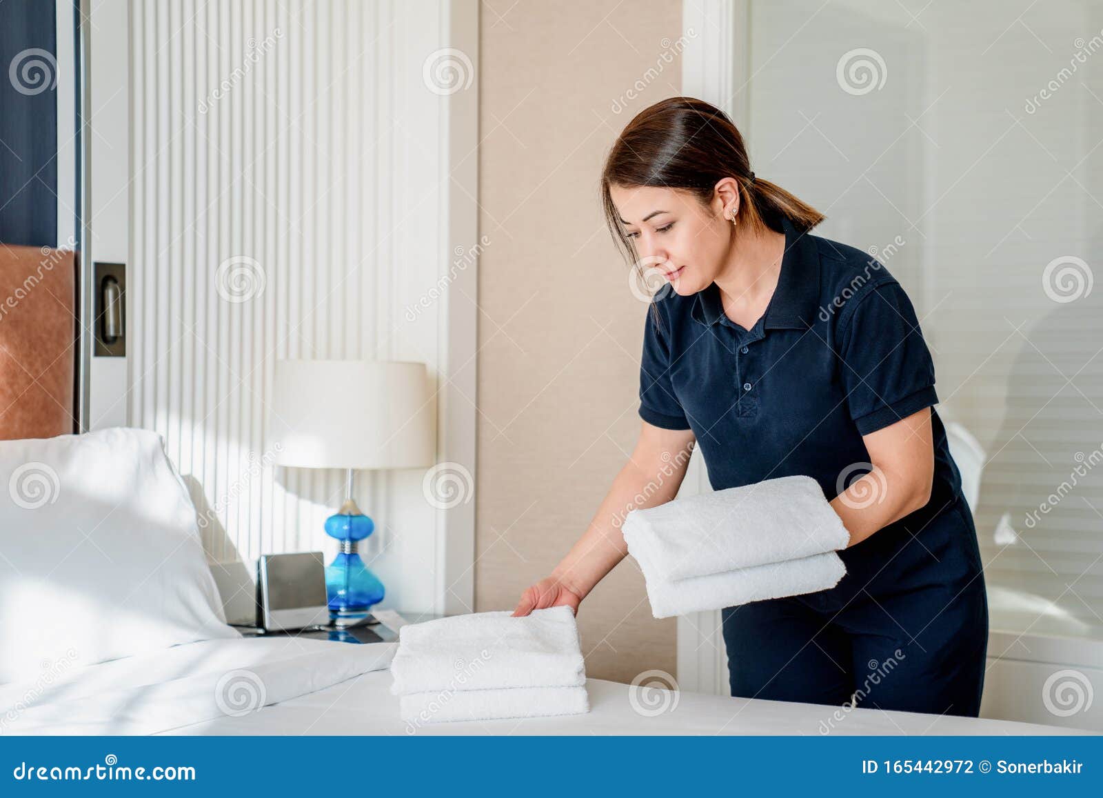 Maid Clean the Room and Replace the Bedsheets and Towels Stock Photo ...