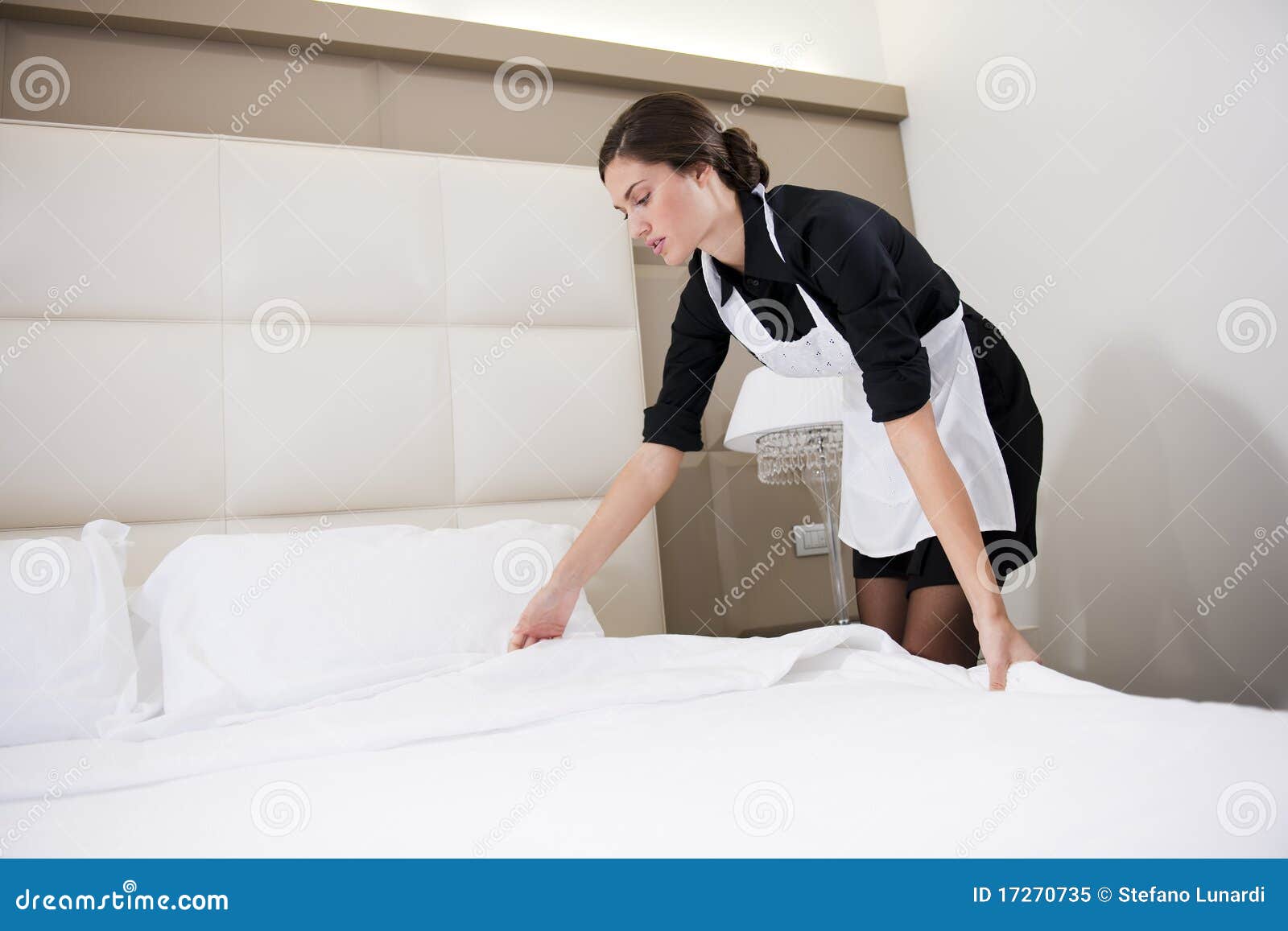 Maid Making Bed stock image. Image of working, black - 17270735