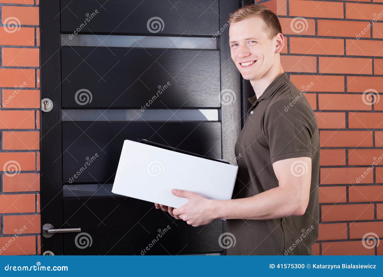 Mail Carrier with a Package Stock Photo - Image of closed, friendly ...