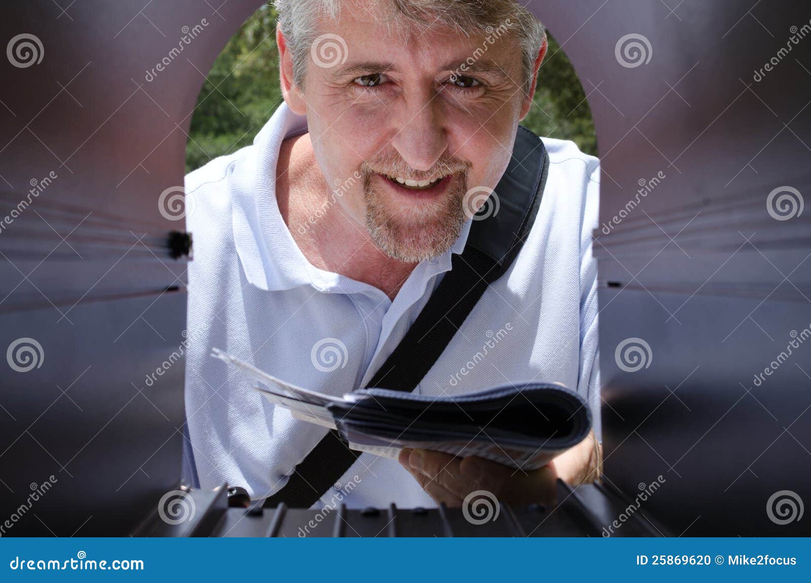 Mailman Making a Delivery of Letters To a Mailbox Stock Photo - Image ...