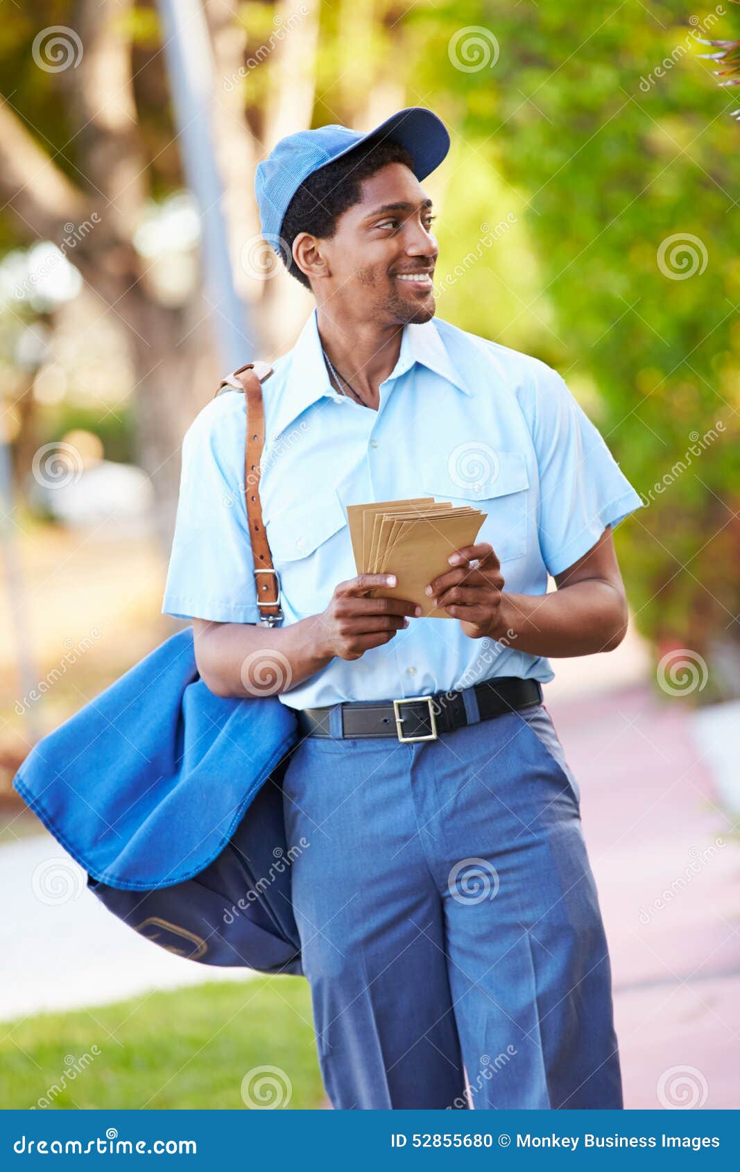 Mailman Walking Along Street Delivering Letters Stock Photo - Image of ...