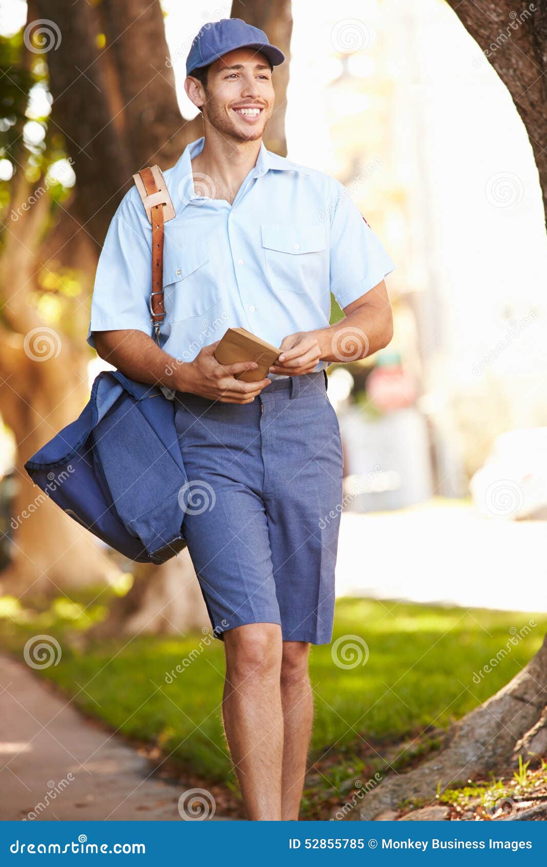 Mailman Walking Along Street Delivering Letters Stock Image - Image of ...