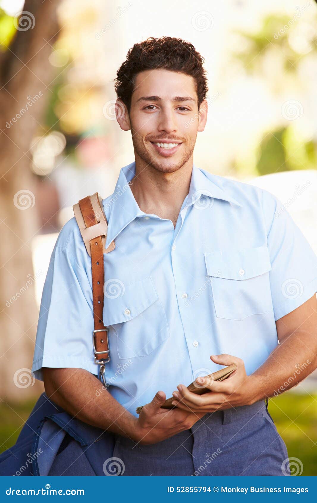 Mailman Walking Along Street Delivering Letters Stock Photo - Image of ...