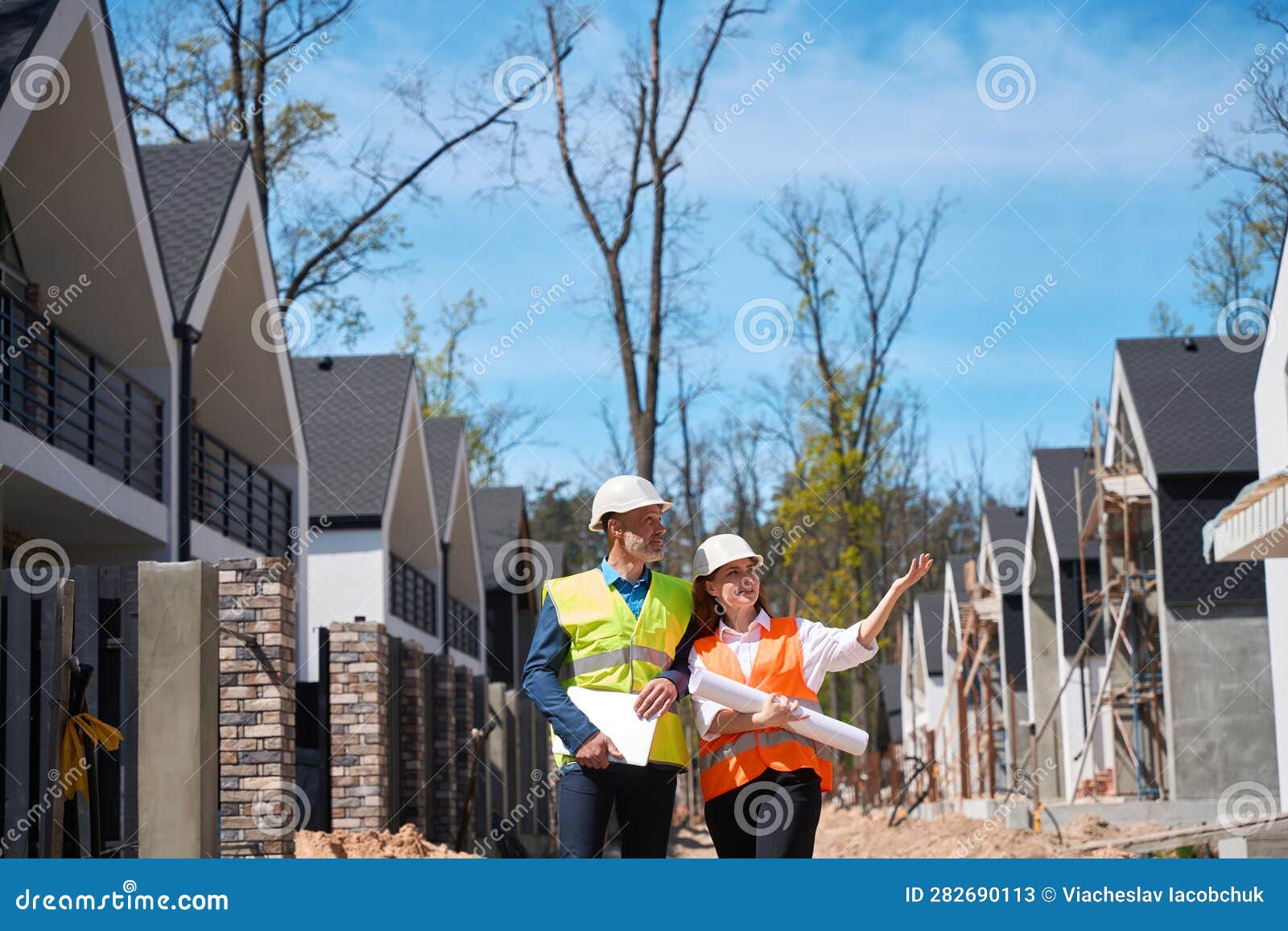 Main Construction Worker Showing Construction Site To Housing Developer ...