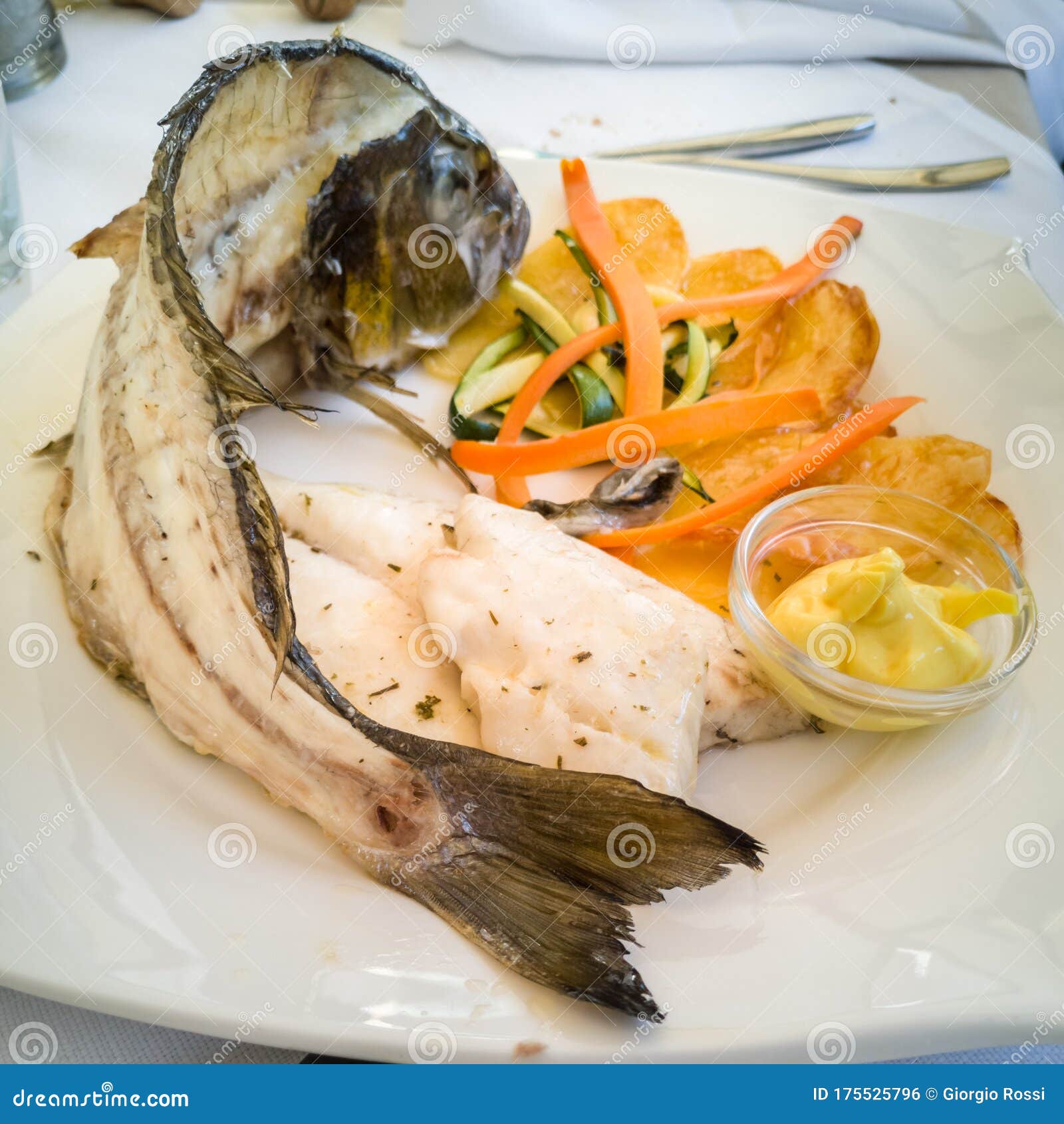 Main Course with Roast Fish, Thin Potatoes, Carrots, Zucchini and Sauce ...