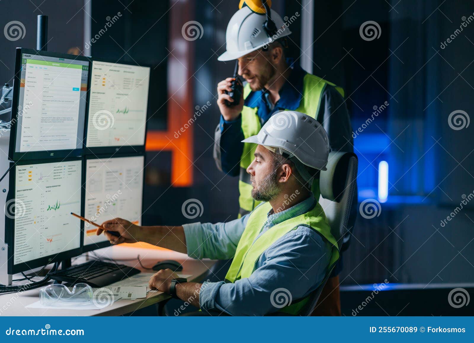 Main Engineer and Workers Operator Wearing Safety Vests and Hard Hats ...