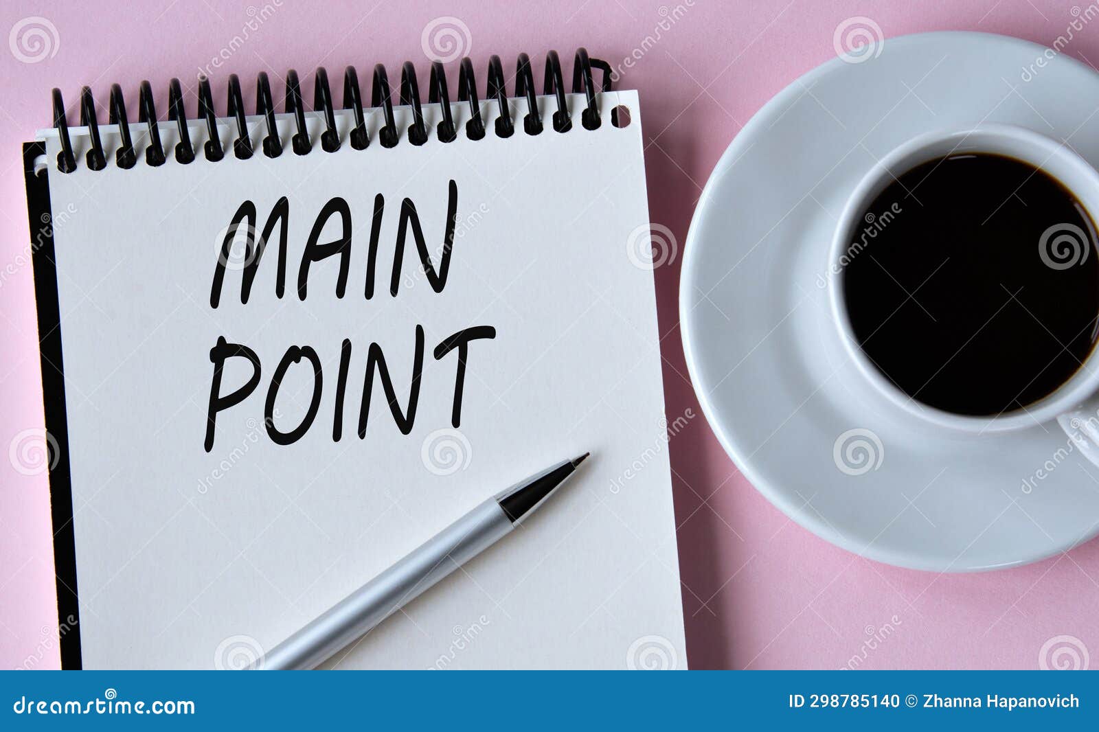 MAIN POINT - Words Written in a Notebook on the Background of a Cup of ...