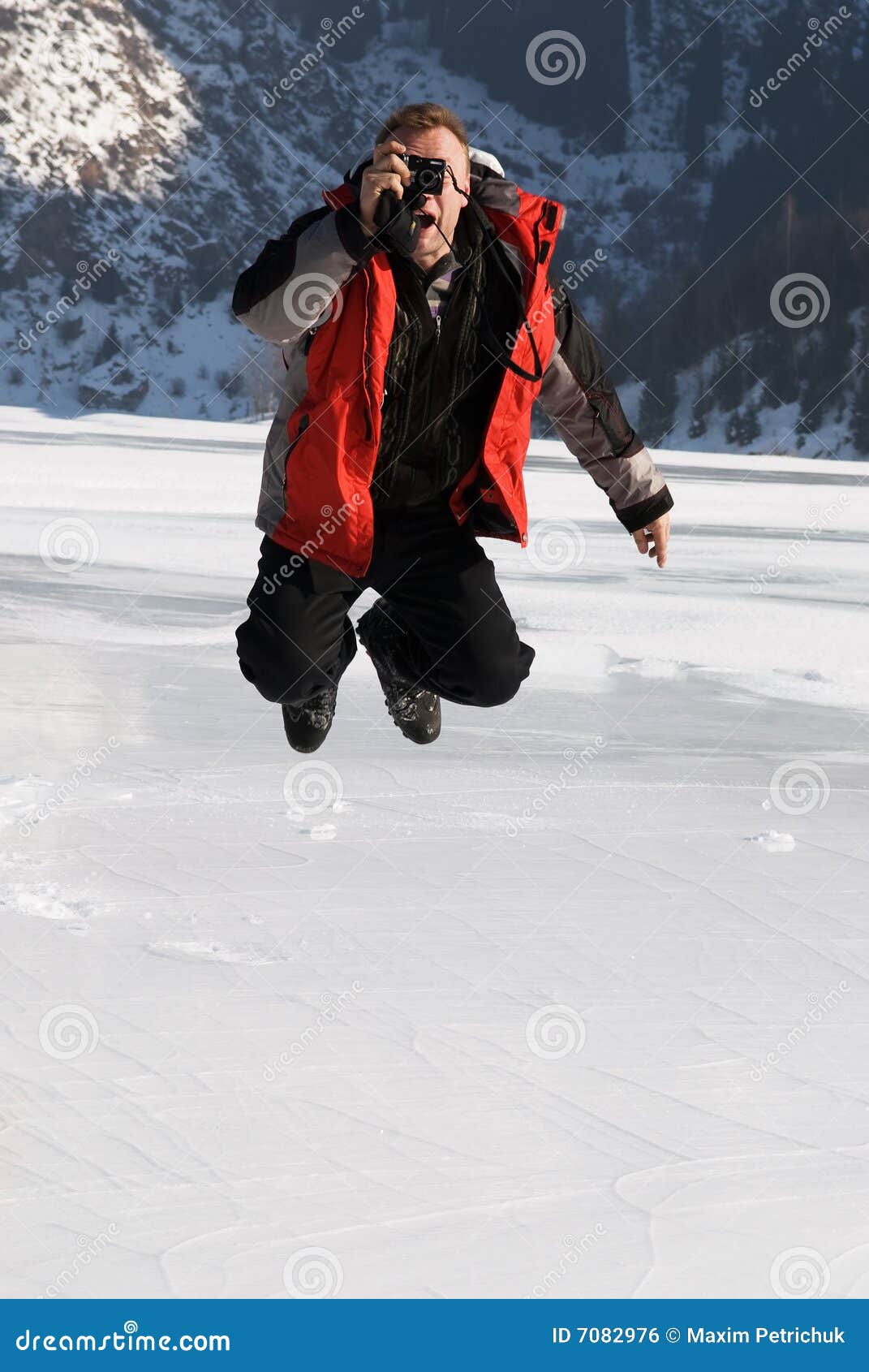 Main in Red Jumping on Winter Lake Stock Photo - Image of high, jumping ...