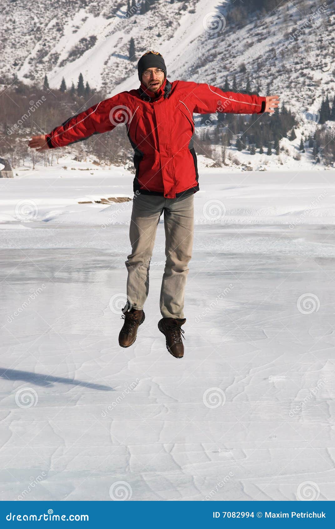 Main in Red Jumping on Winter Lake Stock Photo - Image of motion, lake ...