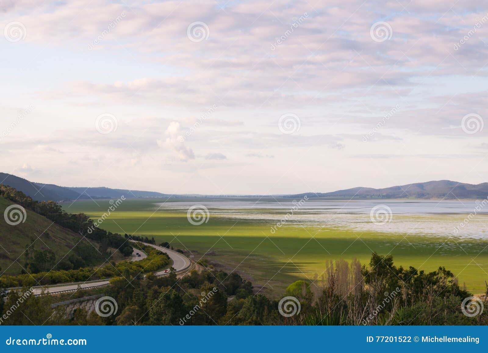 Main Road between a Mountain Range and Half Empty Lake Stock Photo ...
