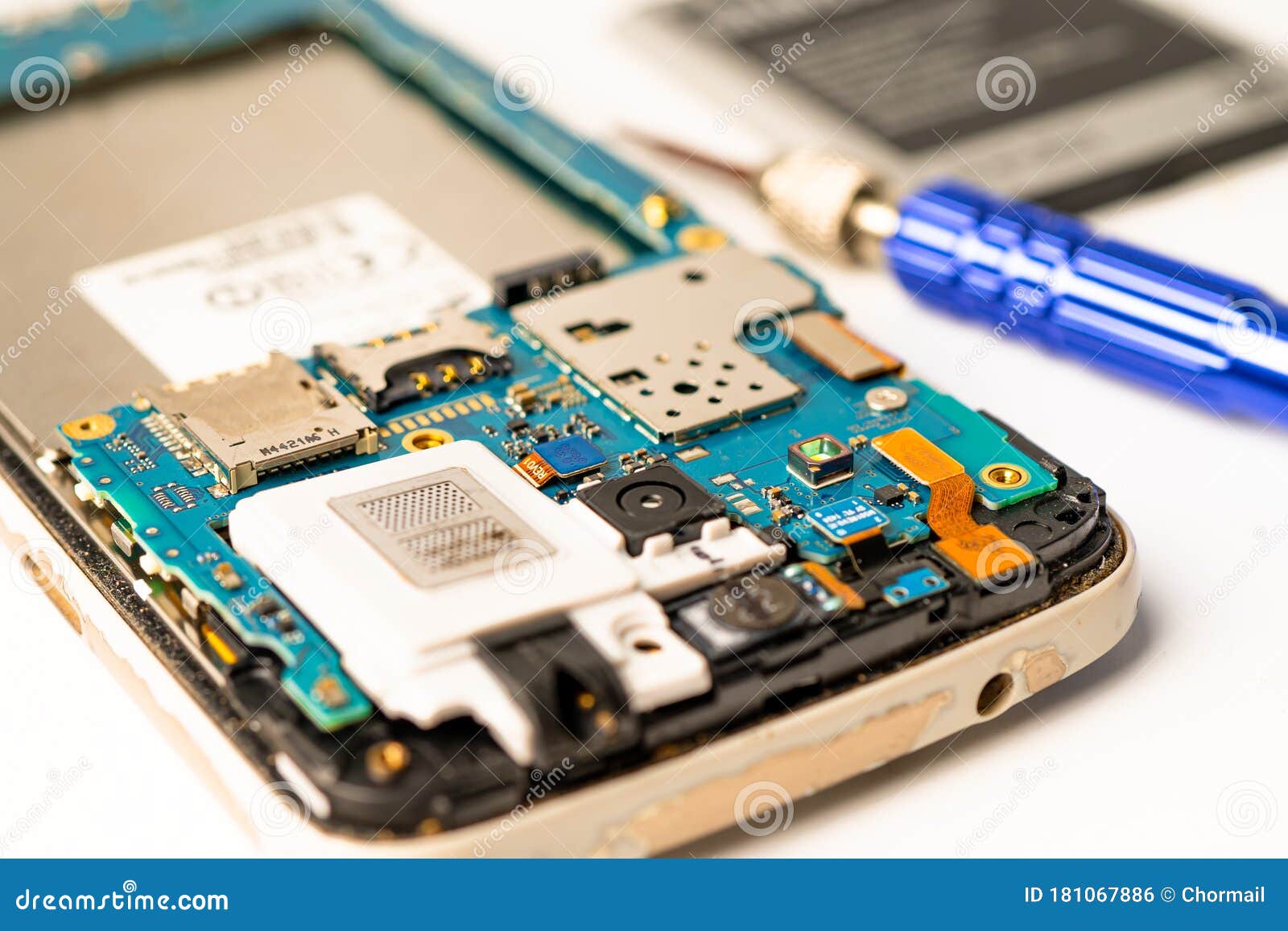 Mainboard Circuit Inside of Mobile Phone with Soldering Iron Stock ...