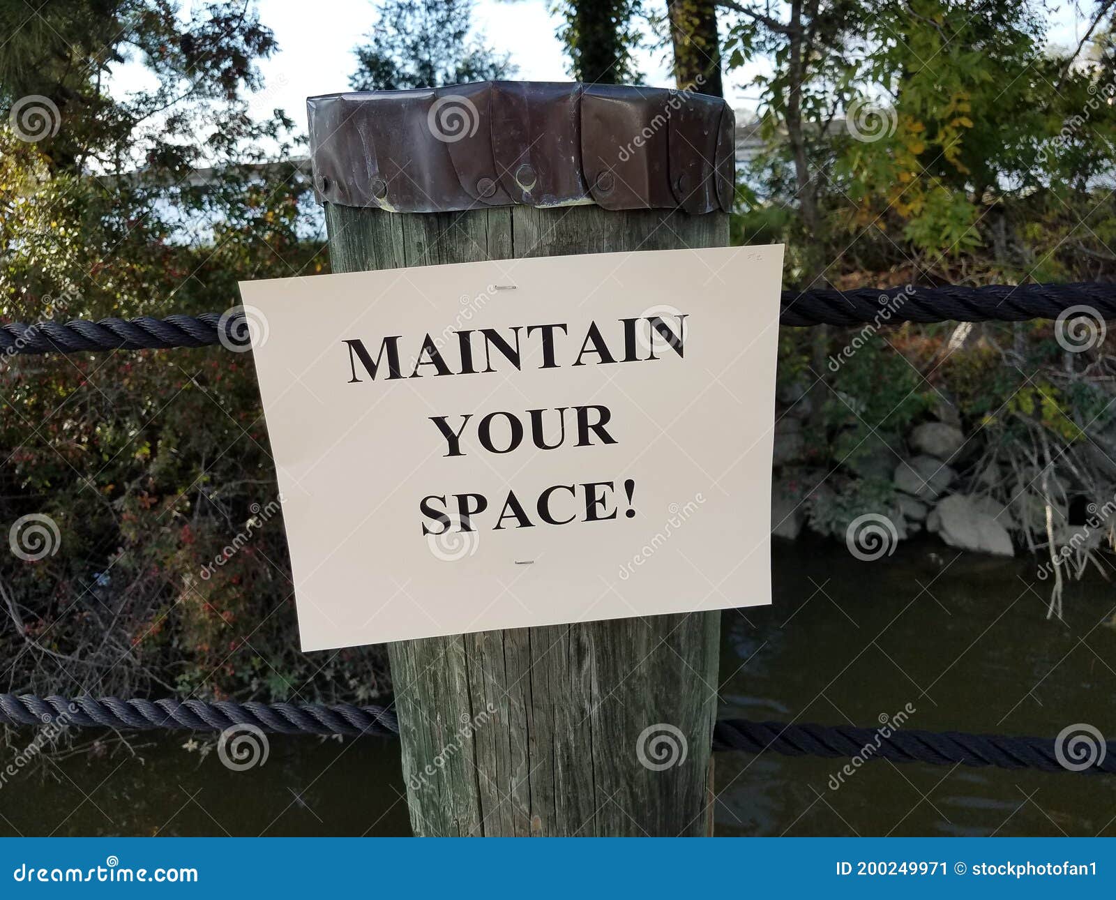 Maintain Your Space Sign on Wood Post Stock Image - Image of paper ...