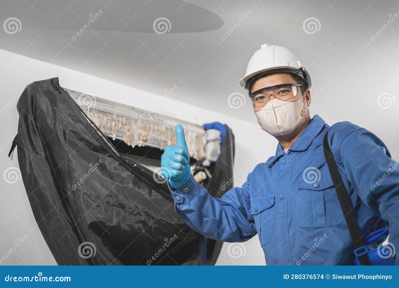 An Air Conditioner Technician Showing a Success Gesture To the Camera ...