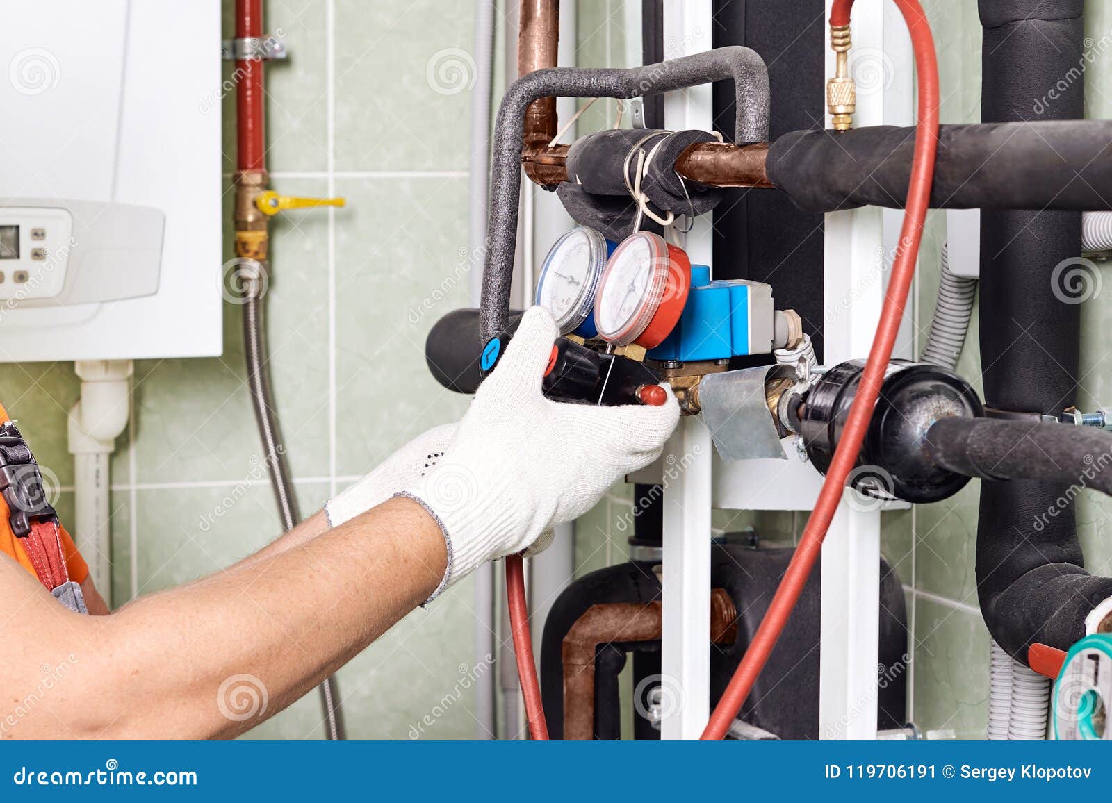 Maintenance Engineer Checking Technical Data of Heating System. Stock ...